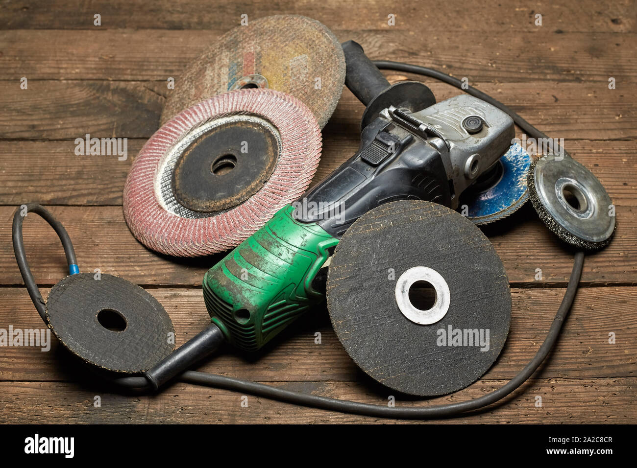 old angle grinder with a worn green handle, cutting and grinding wheels ...