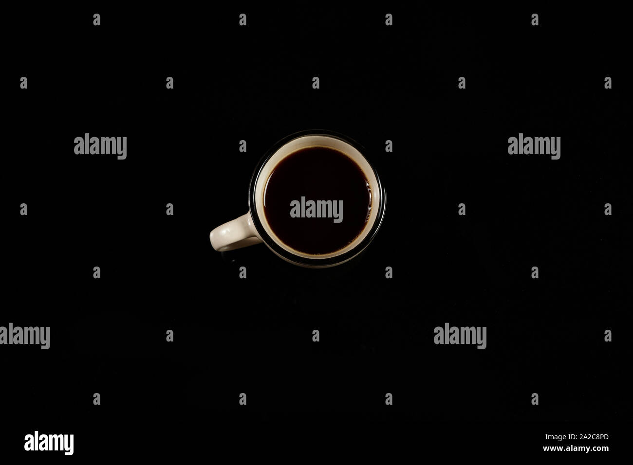 beige coffee Cup on a black isolated background. on black glass Stock ...