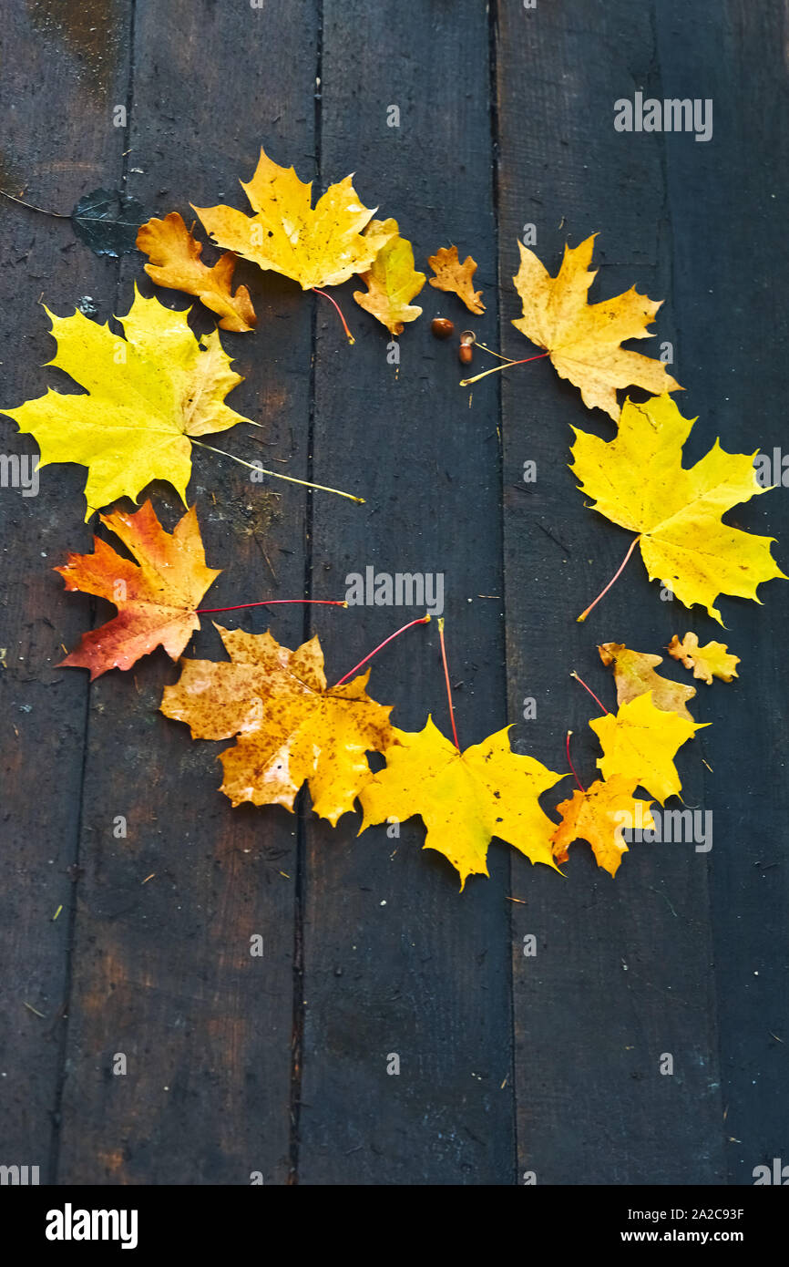 frame of autumn maple leaves close-up on a wooden background Stock ...