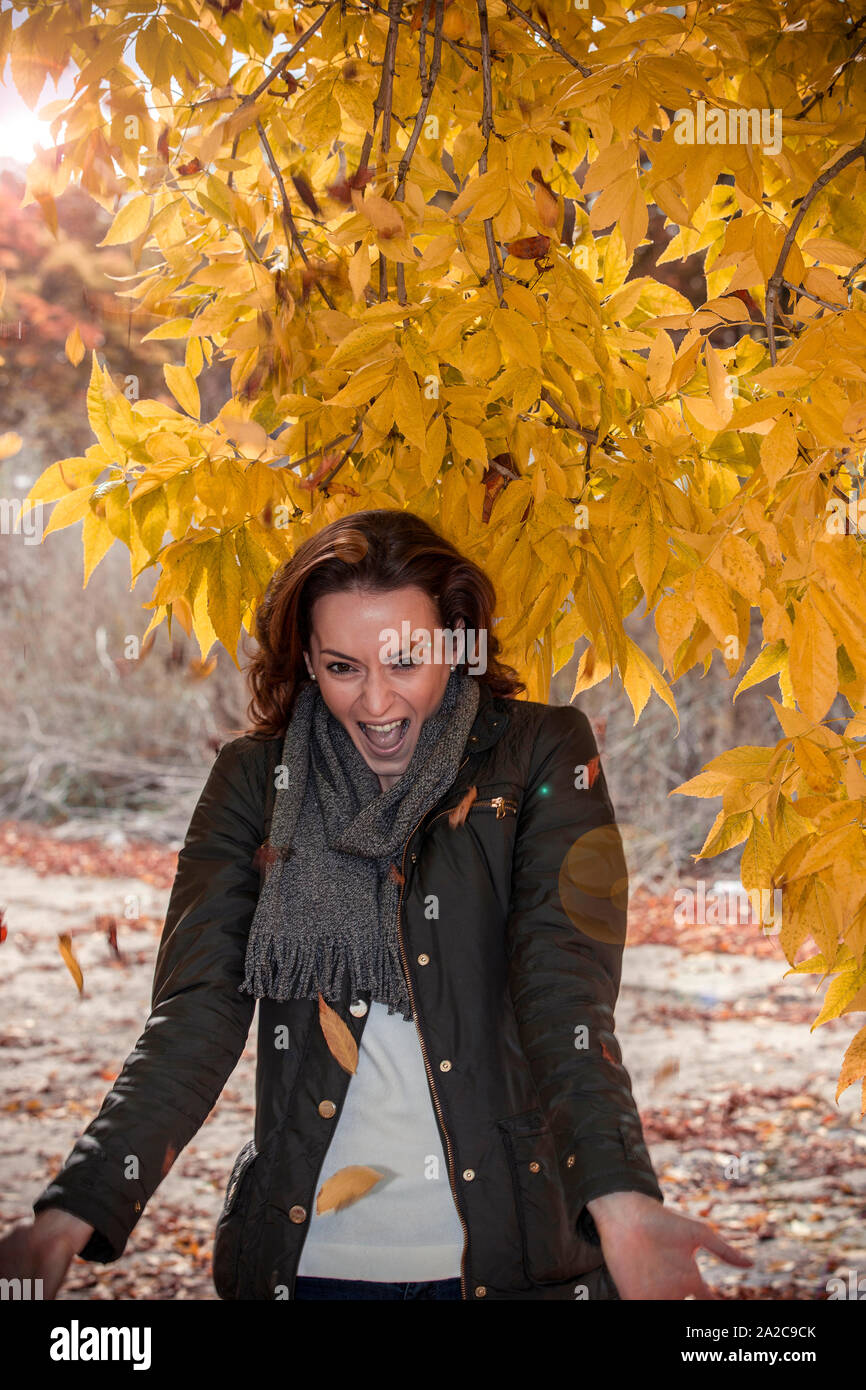 Happy young woman throwing orange hi-res stock photography and images ...