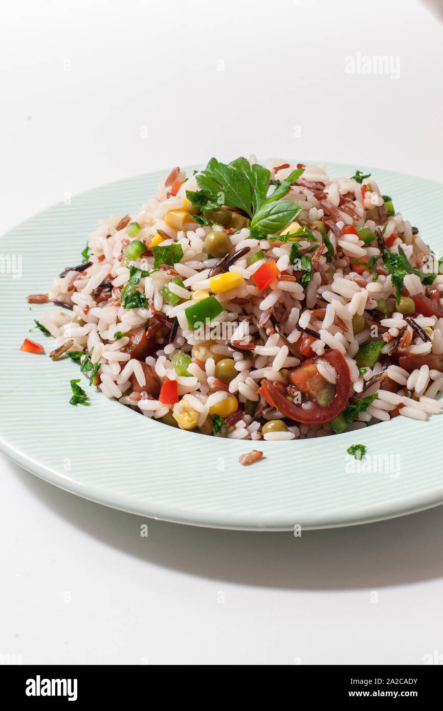 vegetarian rice salad only with veggies and herbs Stock Photo - Alamy