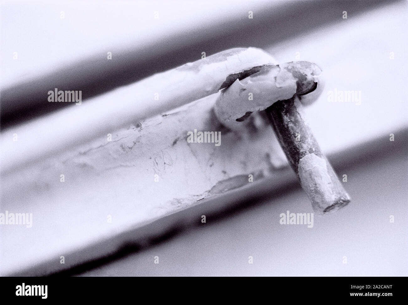 A painted window hook and latch on a window sill Stock Photo - Alamy