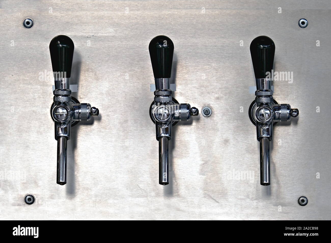 three taps to tap the beer Stock Photo - Alamy