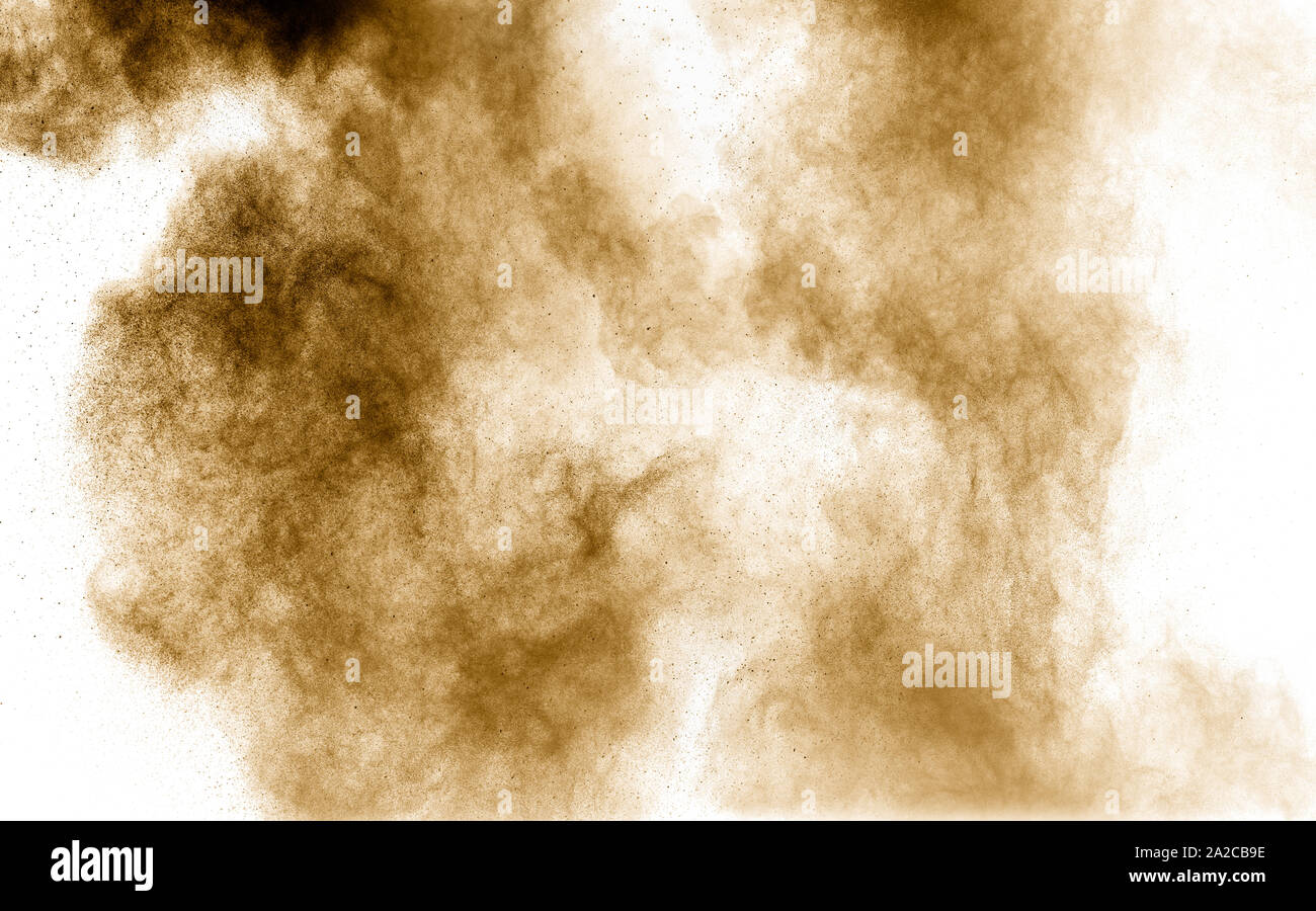 Brown dust explosion cloud.Brown particles splatter on white background ...