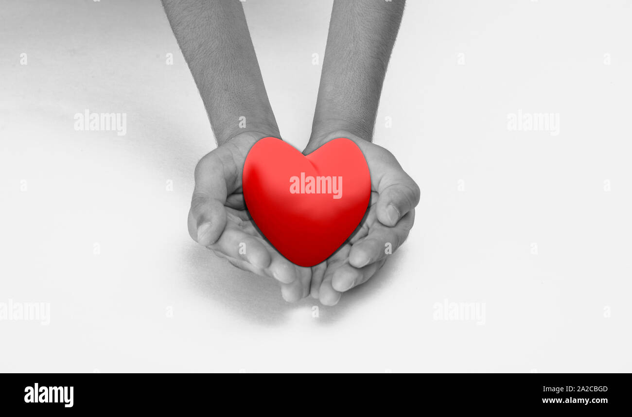 Hand holding red heart icon on white background, message of peace Stock ...