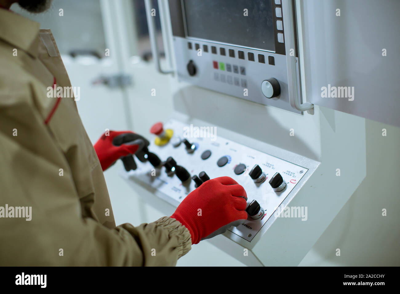 Portrait of senior man operating machine units in modern wooden factory ...