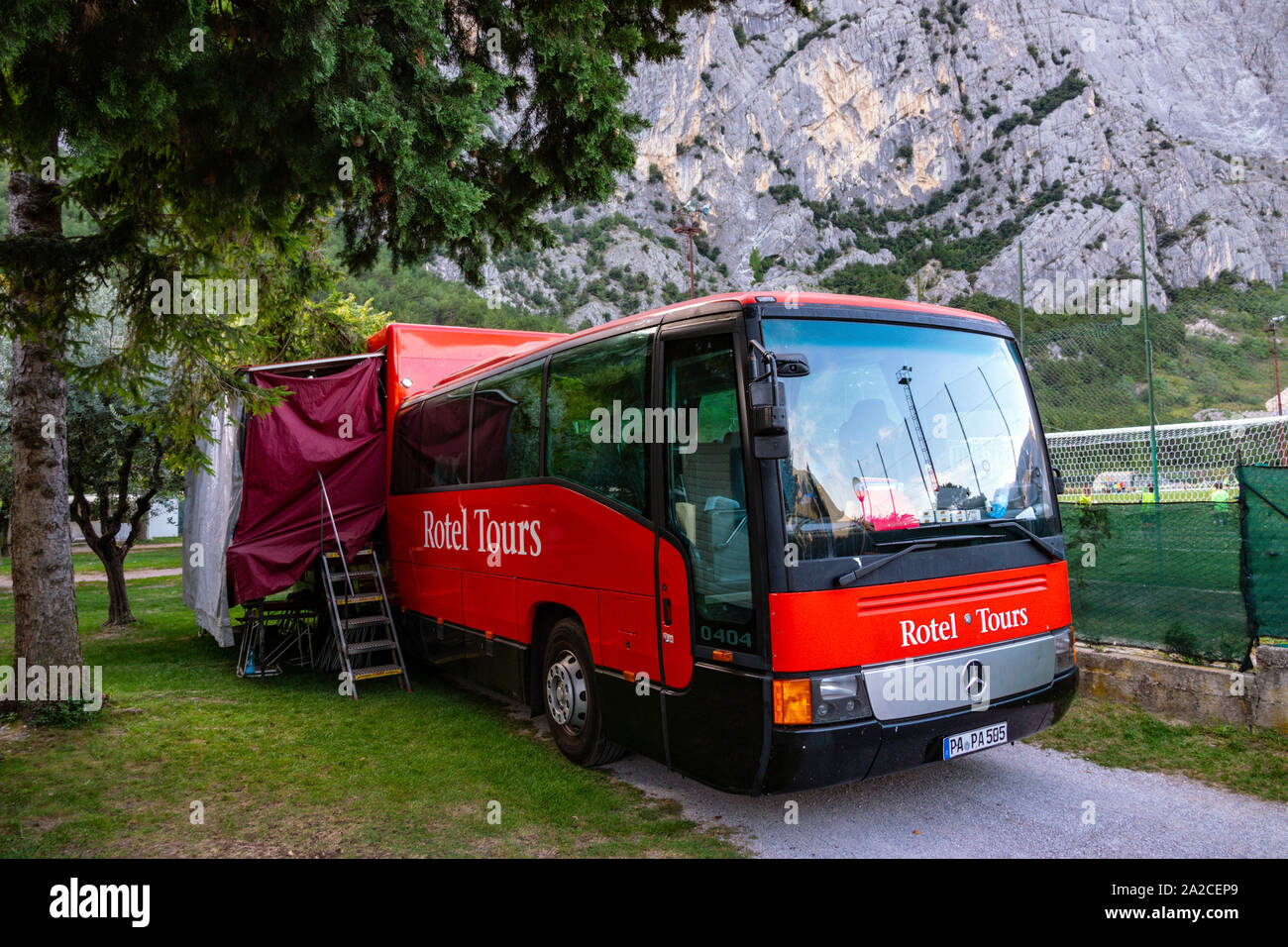 Huge red Mercedes bus, Rotel Tours, in the Italian Dolomites, Canazei ...