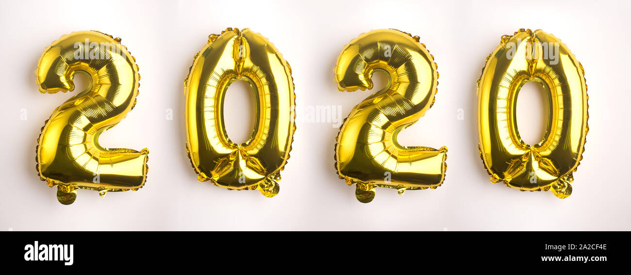 Golden Helium balloons with 2020 on white background Stock Photo - Alamy