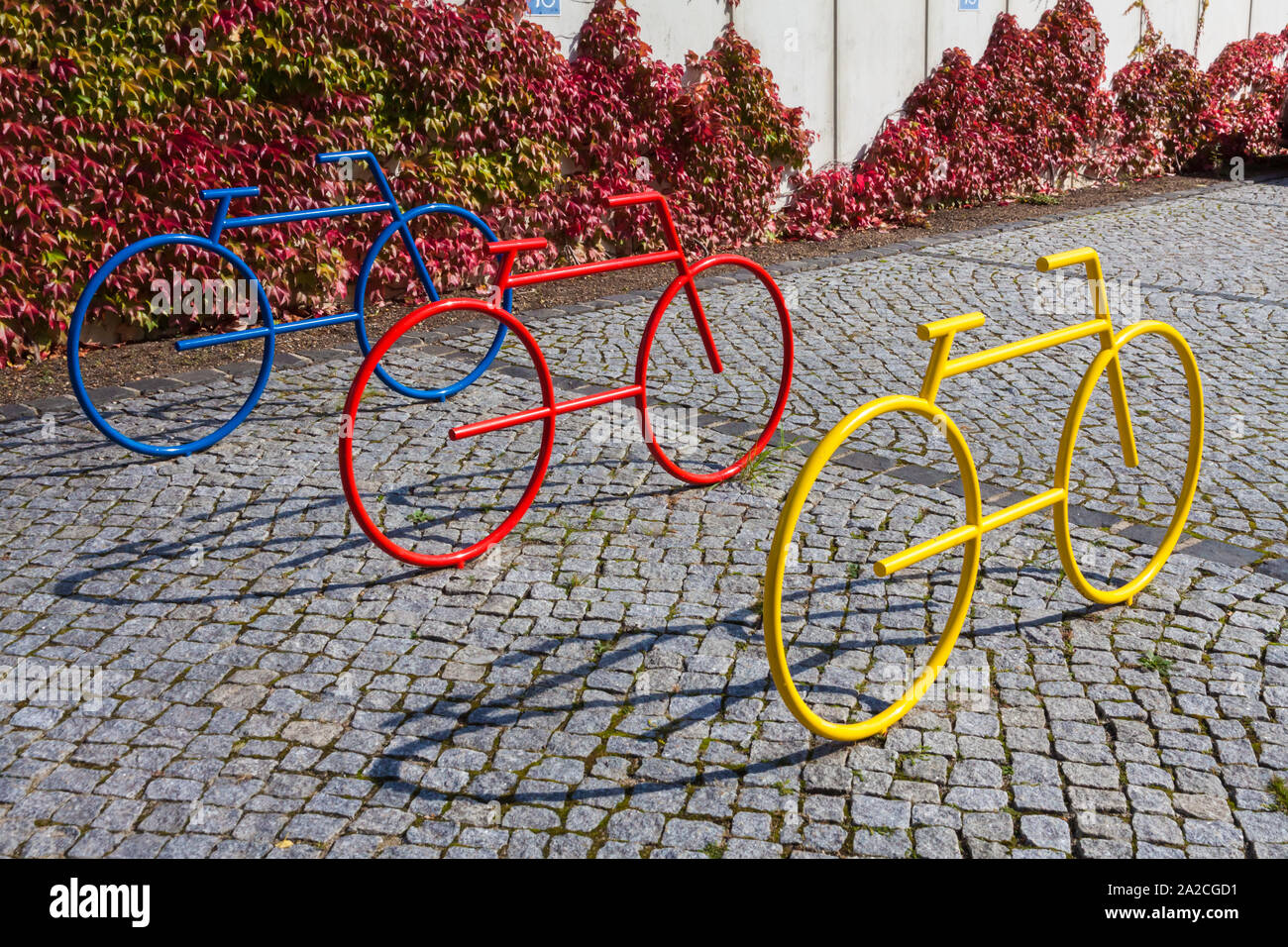 Colorful bicycle statues as stand Stock Photo - Alamy