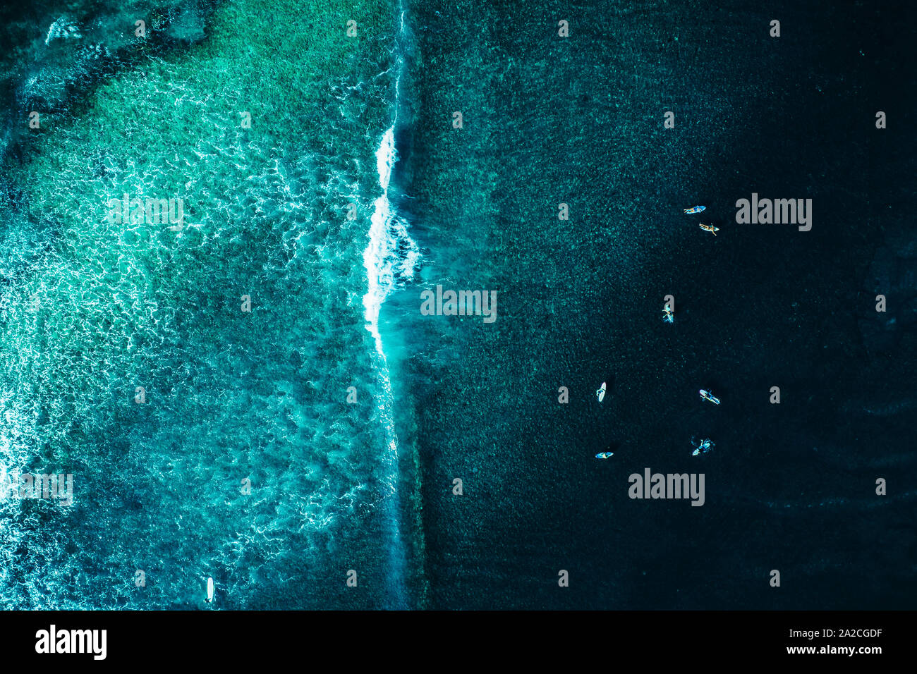Aerial view looking straight down onto large waves in a tropical ocean ...