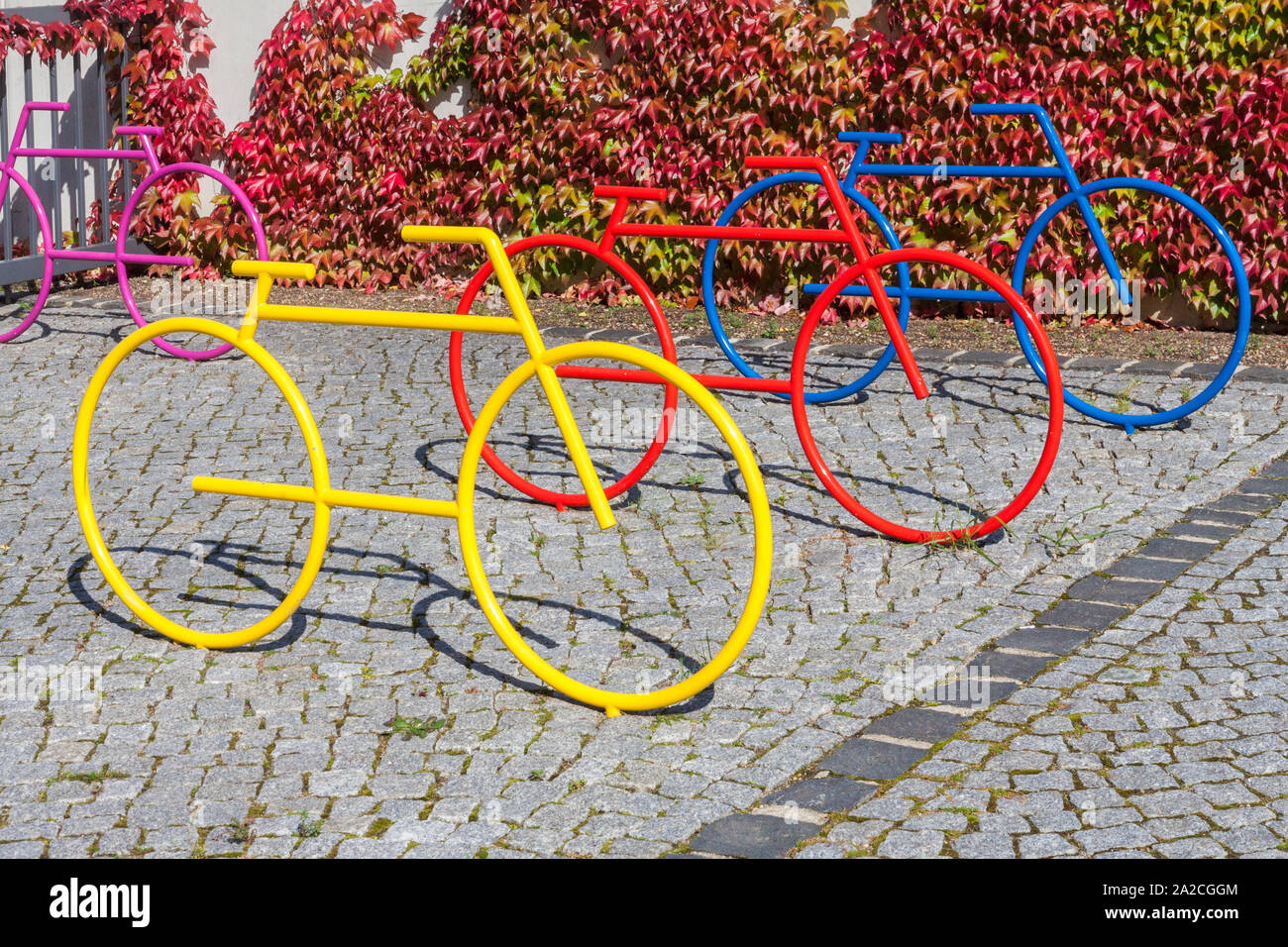 Colorful bicycle statues as stand Stock Photo - Alamy