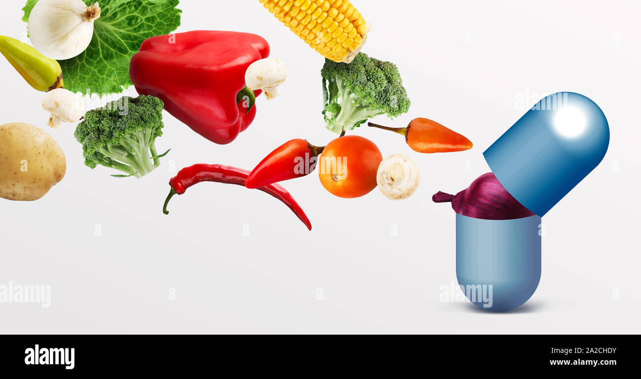 Modern pill with all need vitamins on white background Stock Photo - Alamy