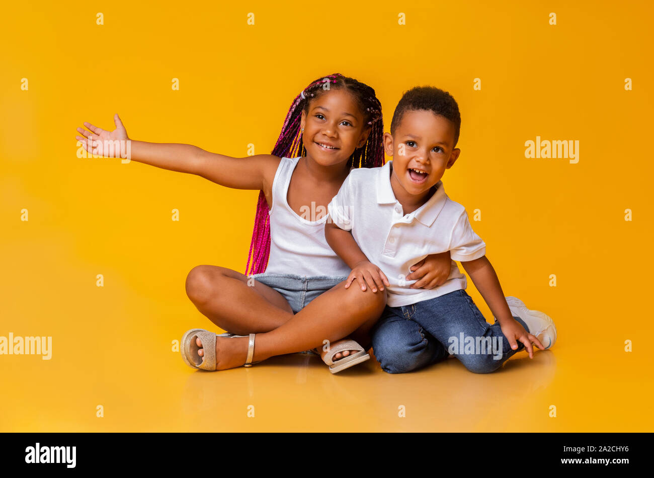 Brother sister cuddling hi-res stock photography and images - Alamy