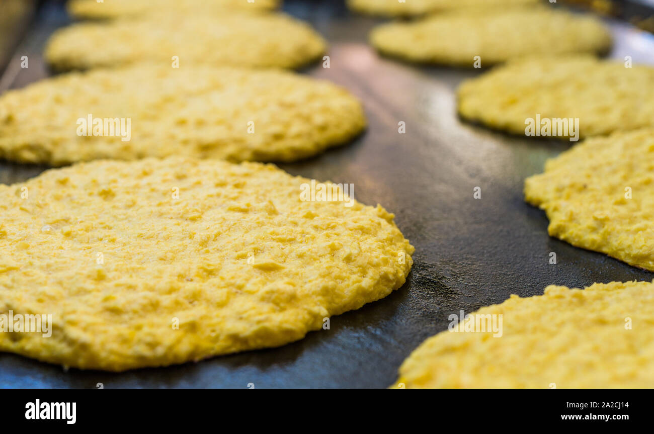 Traditional Venezuelan dish cachapa cooking at a street food market ...
