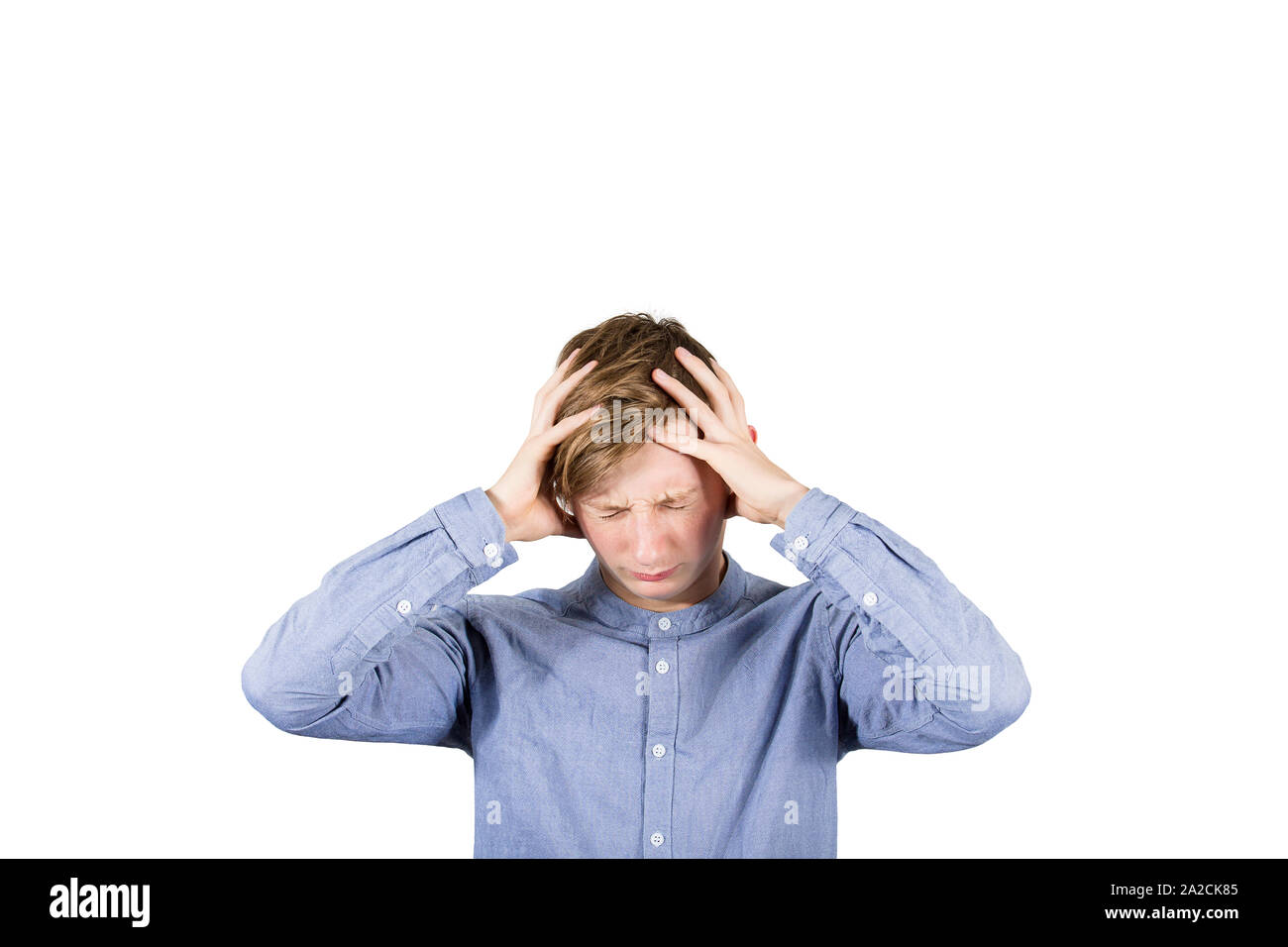 Distressed teenager boy mess in head, hands covering ears, eyes closed ...