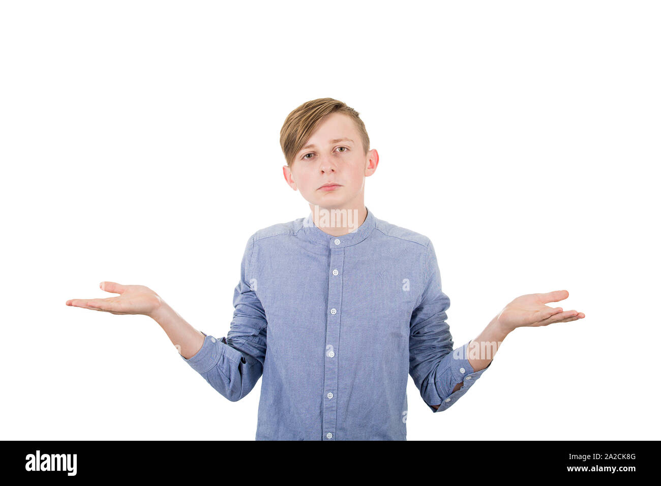 Perplexed teenage boy spread outstretched arms, balancing hands gesture ...