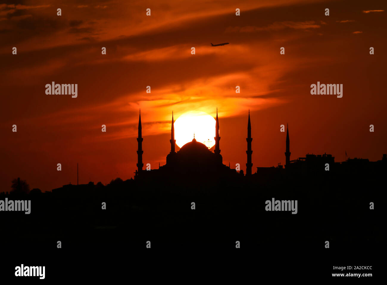 Cityscape of Istanbul with silhouettes of ancient mosques and minarets ...