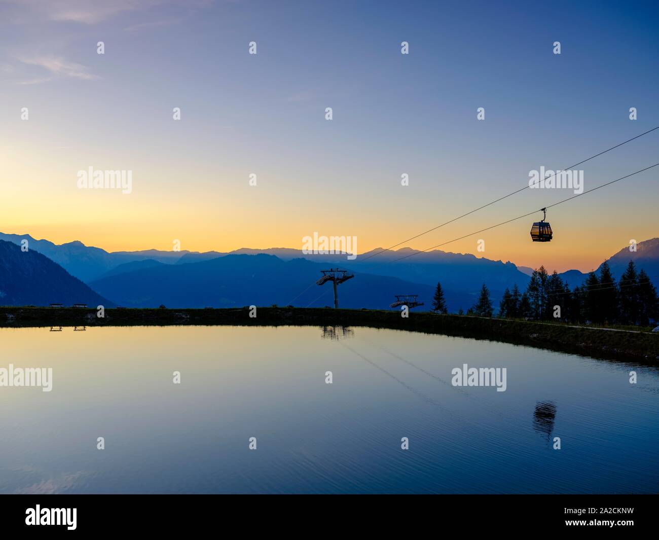 Alpine panorama, gondola of the Jennerbahn cable car reflected in the ...