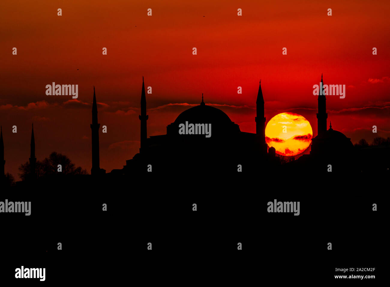 Cityscape of Istanbul with silhouettes of ancient mosques and minarets ...