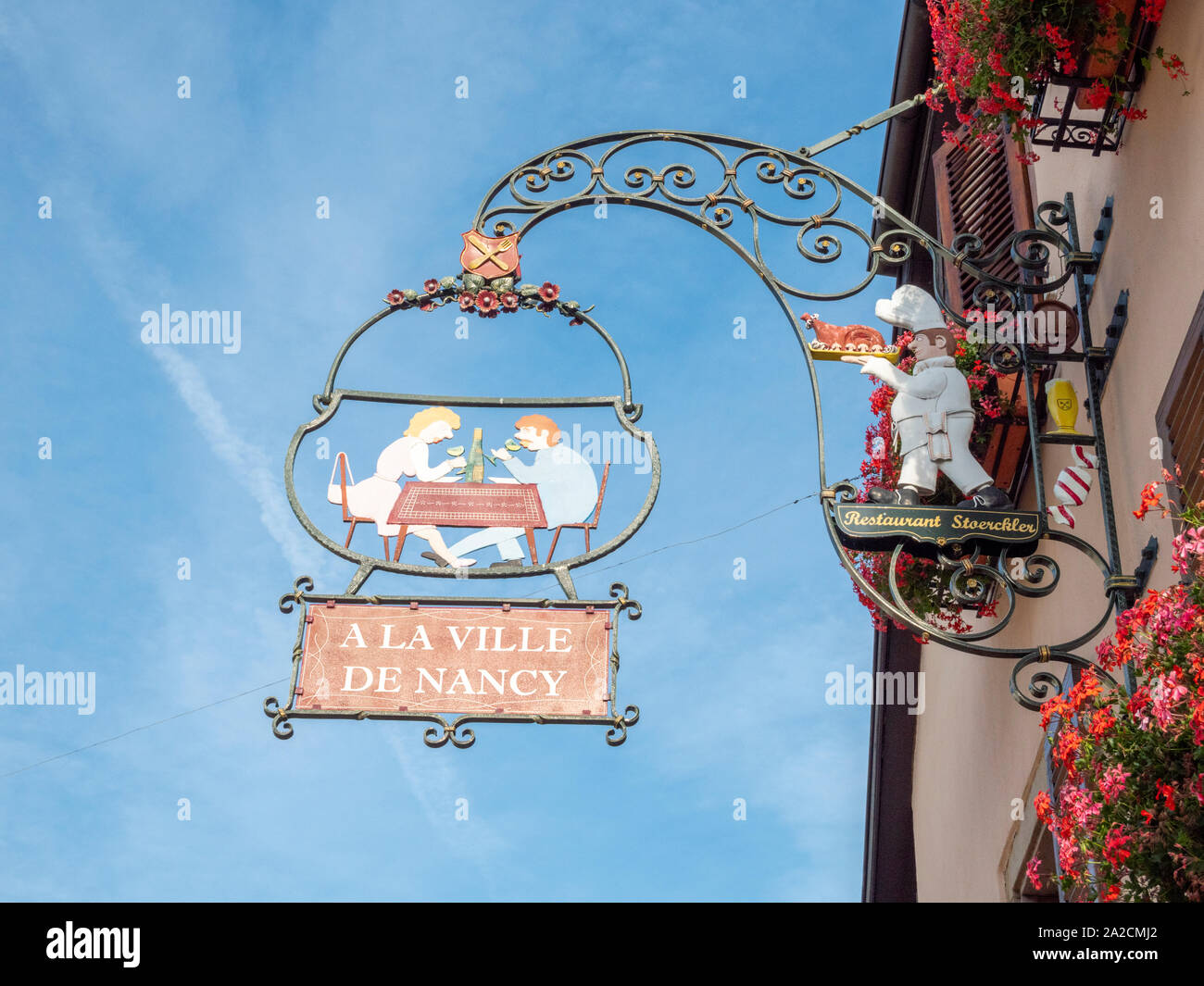 A La Ville de Nancy, a traditional wrought iron sign outside a ...