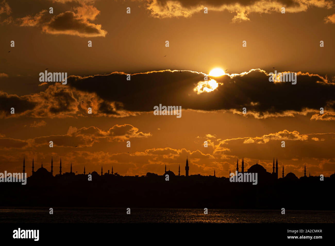 Cityscape of Istanbul with silhouettes of ancient mosques and minarets ...