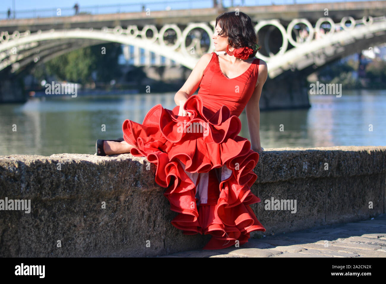 the flamenco dancer sitting on the river bank Stock Photo - Alamy