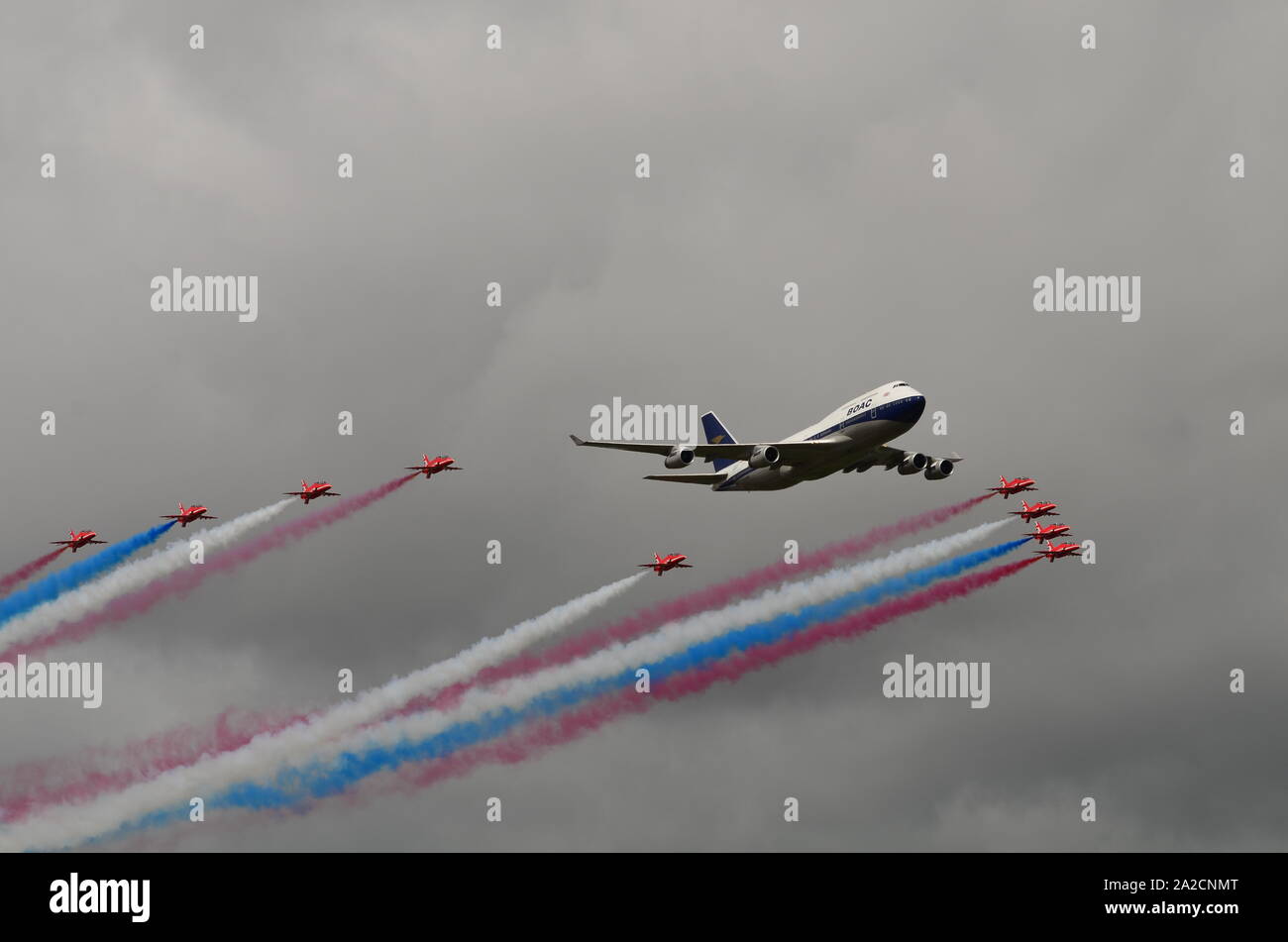 Red arrows and Boeing 747 Stock Photo - Alamy