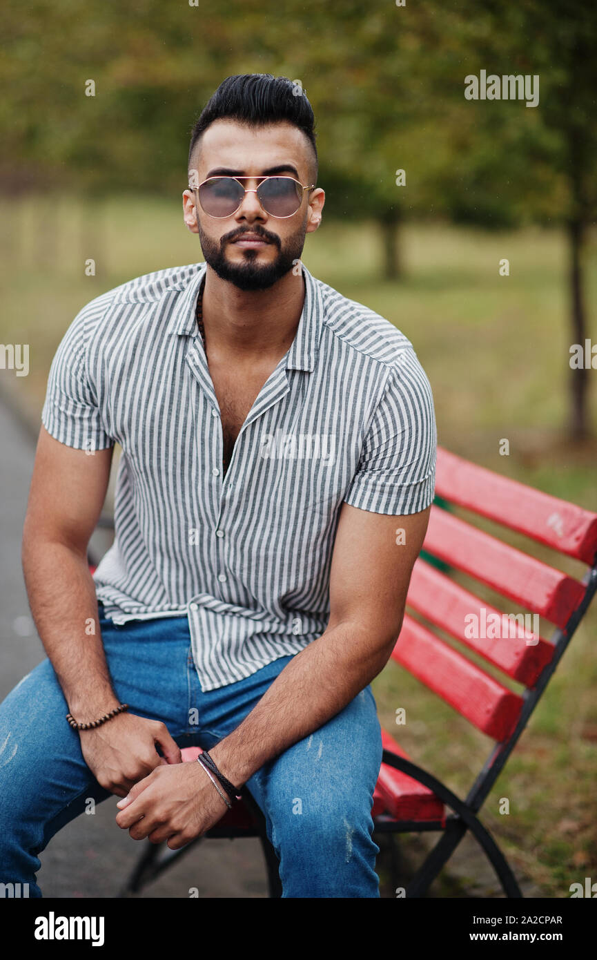 Fashionable tall arab beard man wear on shirt, jeans and sunglasses ...