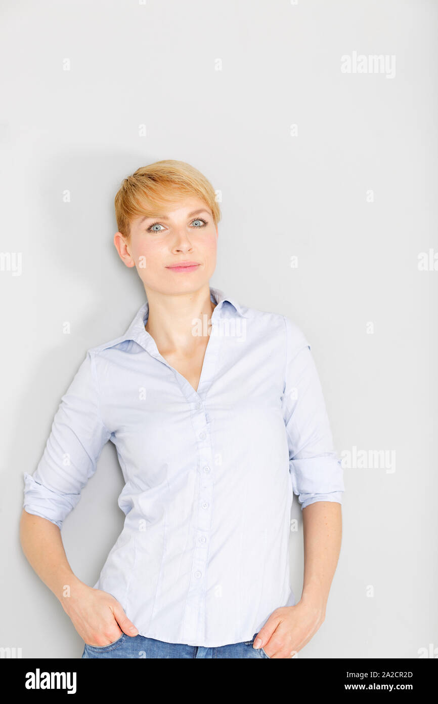 Woman in a blue shirt hi-res stock photography and images - Alamy