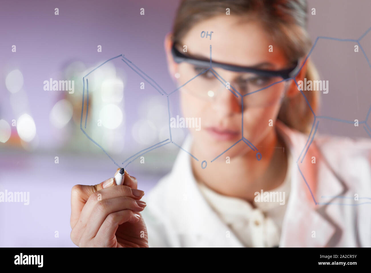 Portrait of a confident female researcher in life science laboratory ...