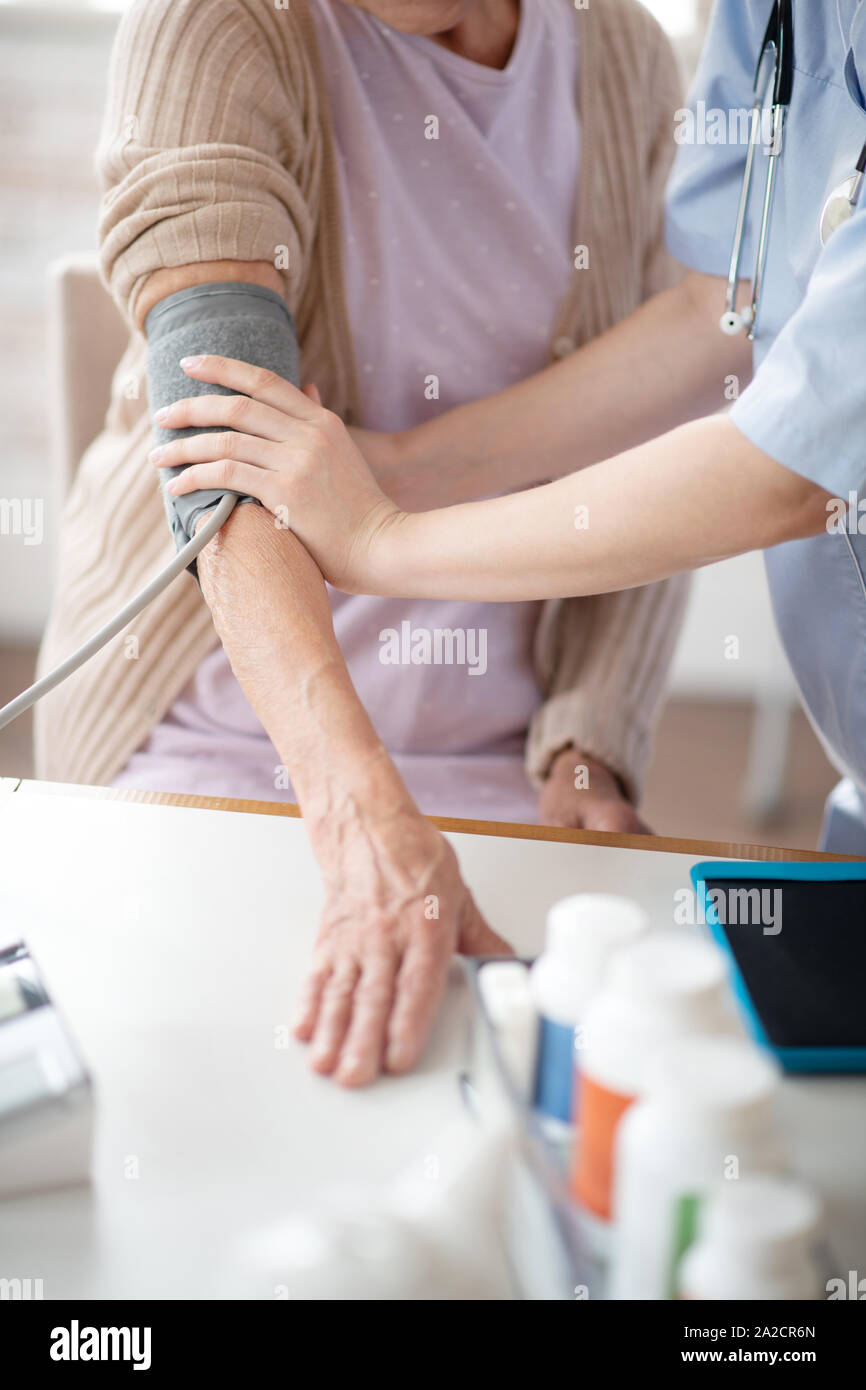 medical-worker-measuring-blood-pressure-for-woman-stock-photo-alamy