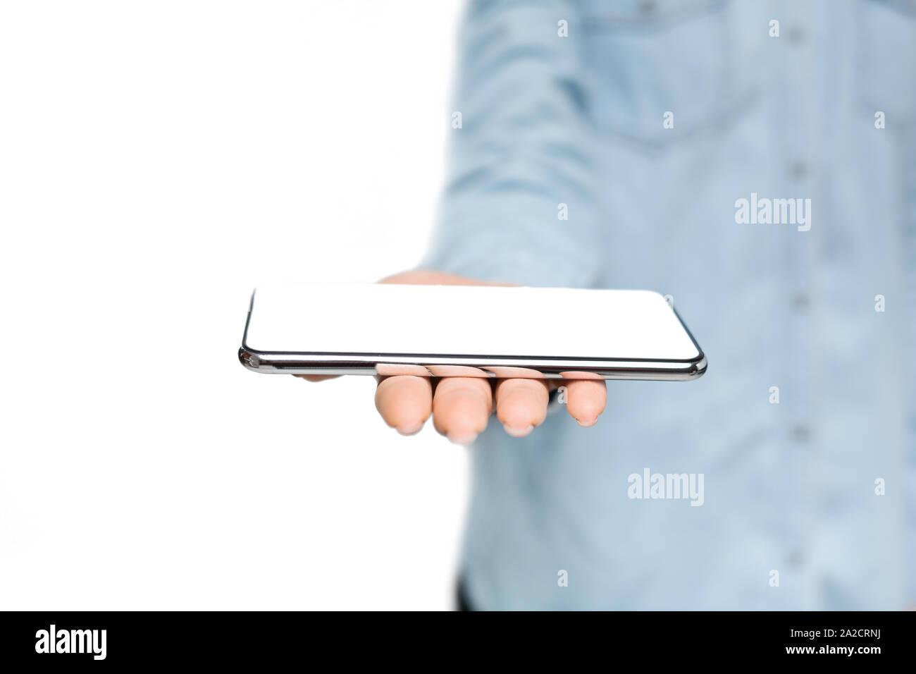 Woman holding modern smartphone with blank screen on open palm Stock ...