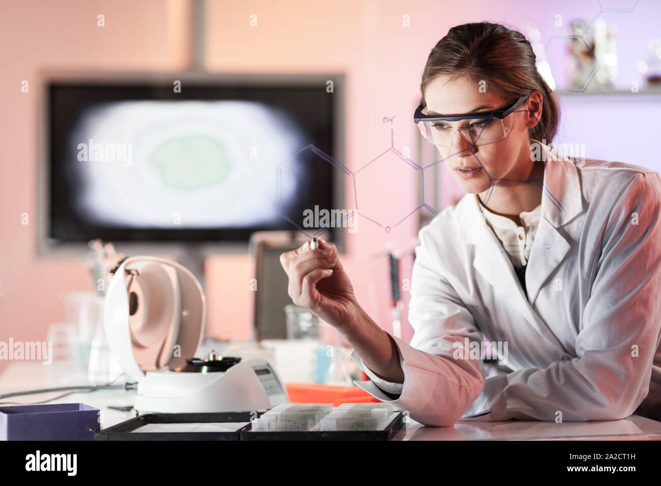 Portrait of a confident female researcher in life science laboratory ...
