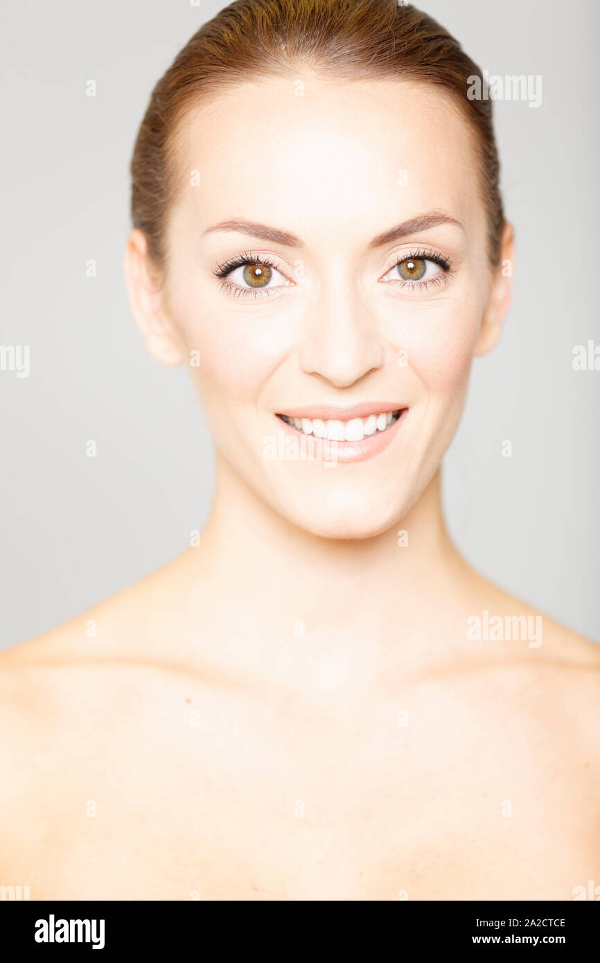 Beautiful young womans face in a beauty style pose Stock Photo - Alamy
