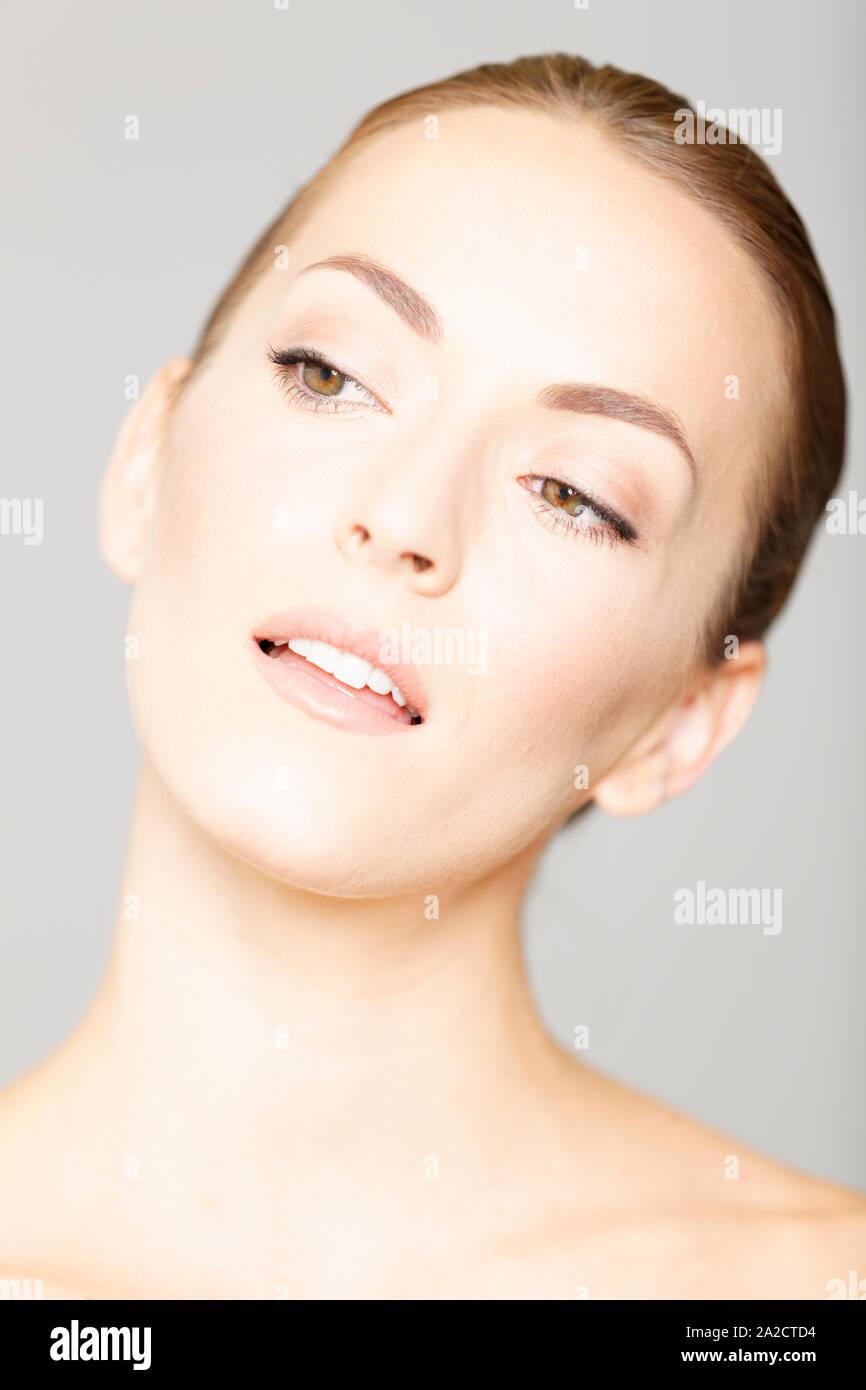 Beautiful young womans face in a beauty style pose Stock Photo - Alamy