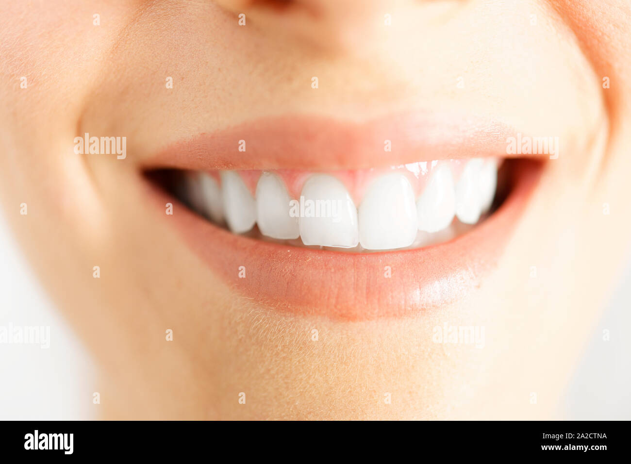 Detail of a woman smile showing white clean teeth Stock Photo - Alamy