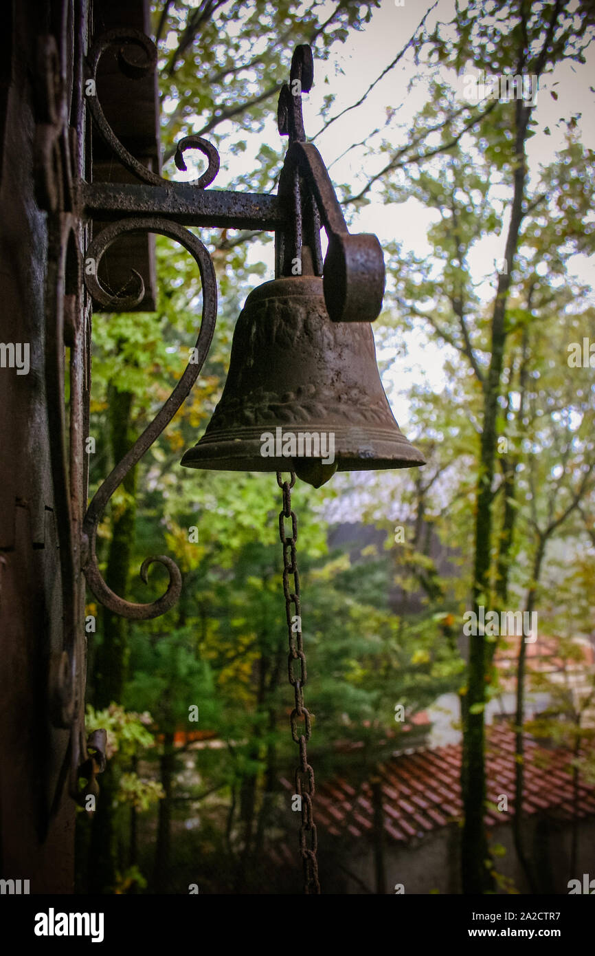 Old welcome bell in an old mountain cottage in Tuscany Stock Photo - Alamy