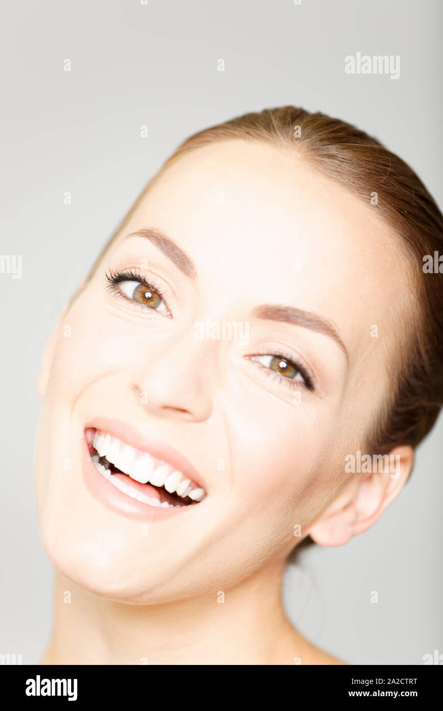 Beautiful young womans face in a beauty style pose Stock Photo - Alamy