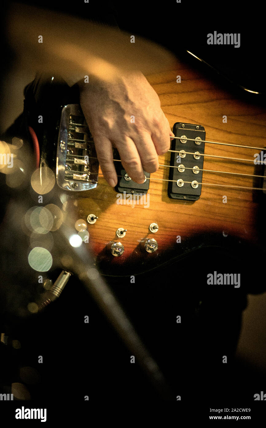 Bass guitar ready for a recording session in a studio Stock Photo - Alamy