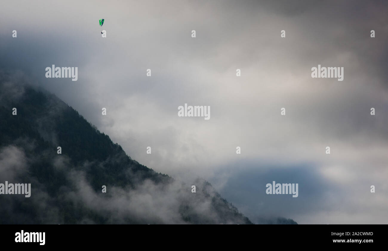 Clouds flying over mountain lake hi-res stock photography and images ...