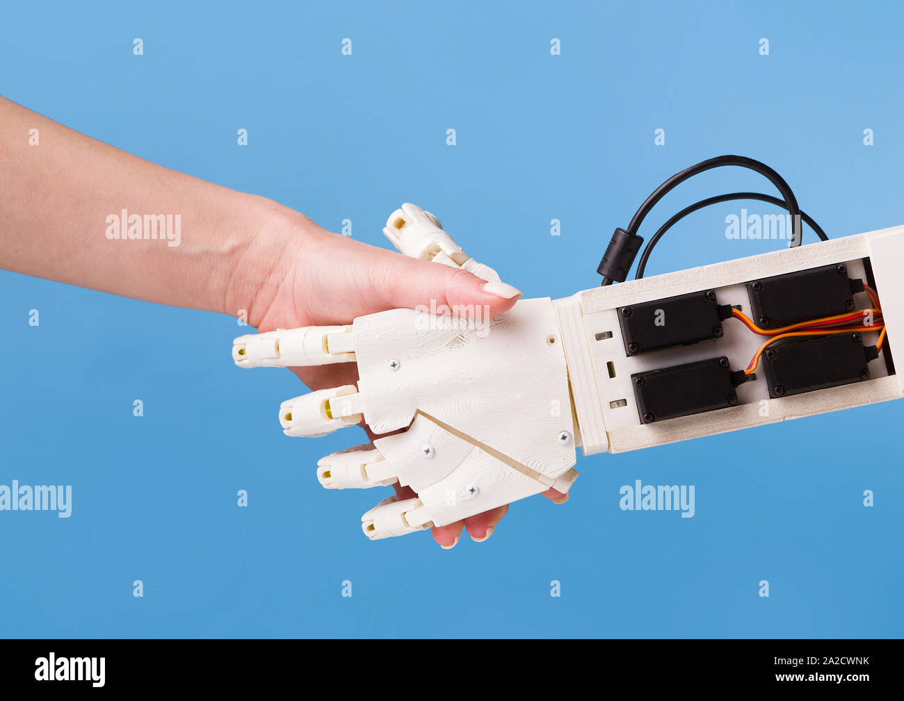 Robot and human handshake. Cooperation of people and technology Stock ...