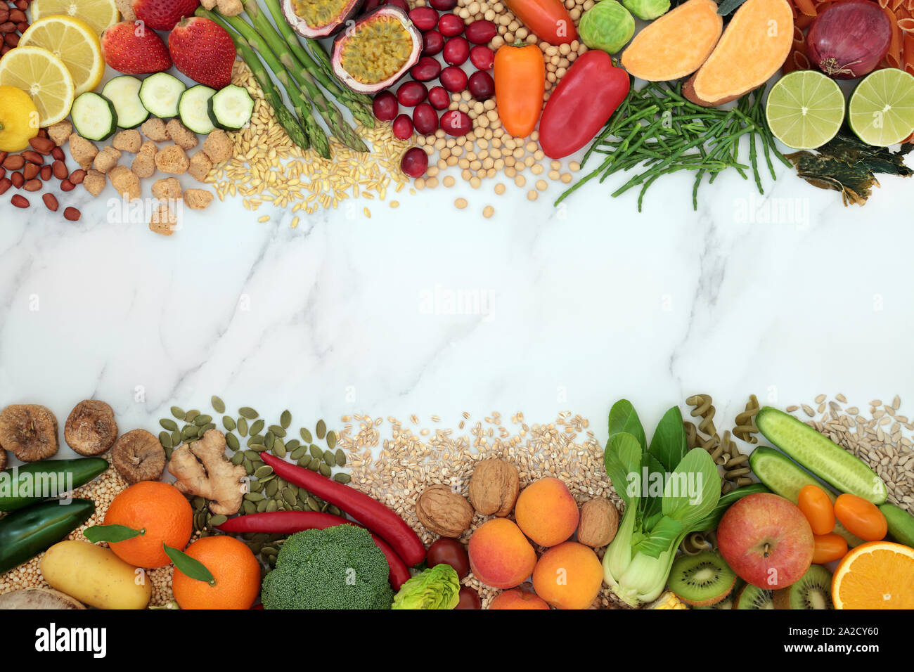Vegan health food background border with a large collection of foods ...