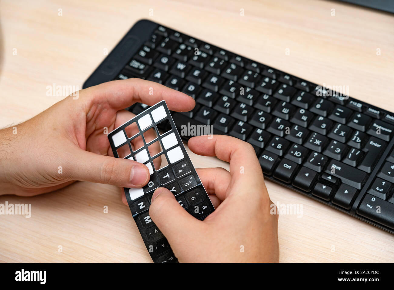 Replacing the alphabet on the keyboard. Stick English letters on the ...