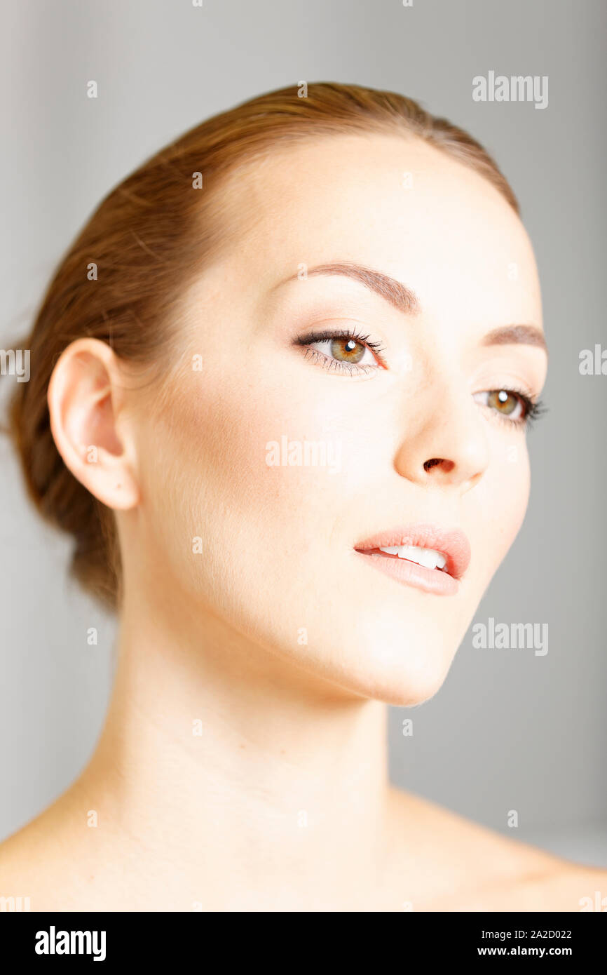 Beautiful young womans face in a beauty style pose Stock Photo - Alamy