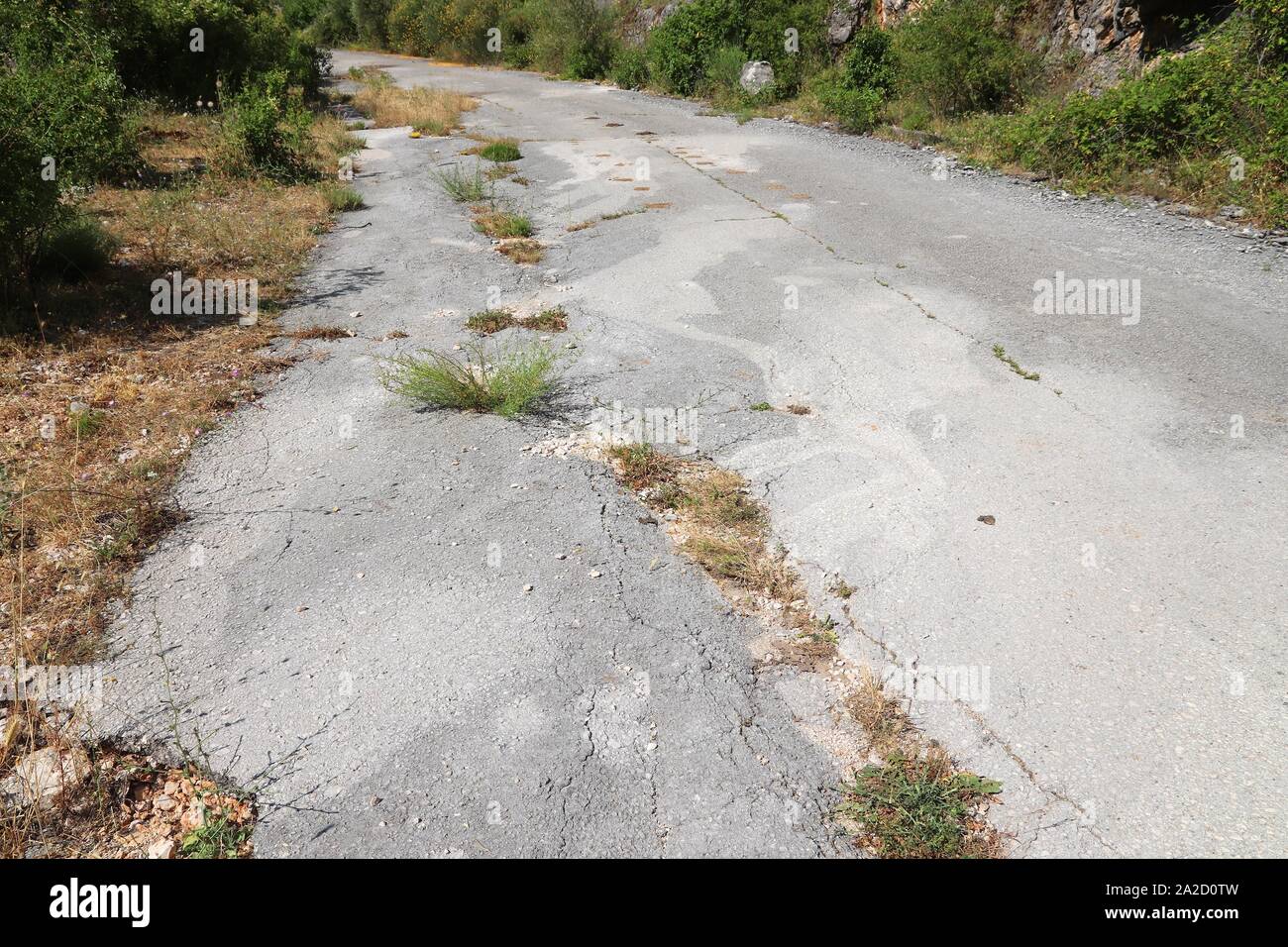 Damaged road in Dalmatia region, Croatia. Countryside road maintenance ...
