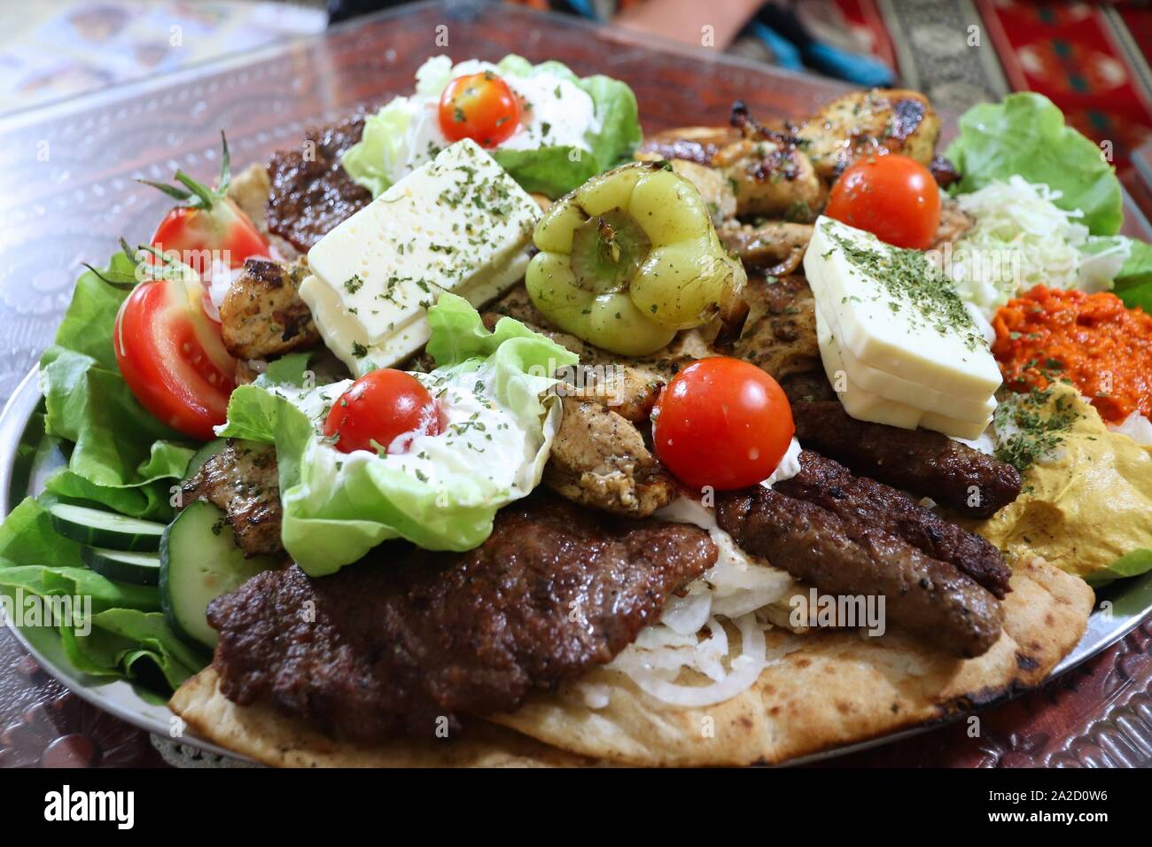 Balkan cuisine in Bosnia and Herzegovina. Mostar grilled meats and ...