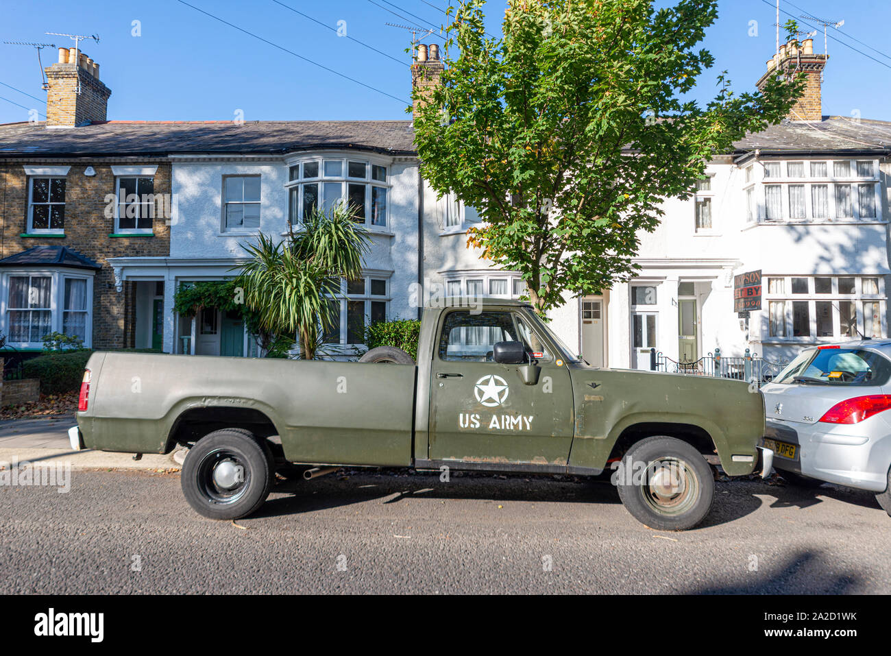 Privately owned US Army painted pickup truck parked in a residential ...