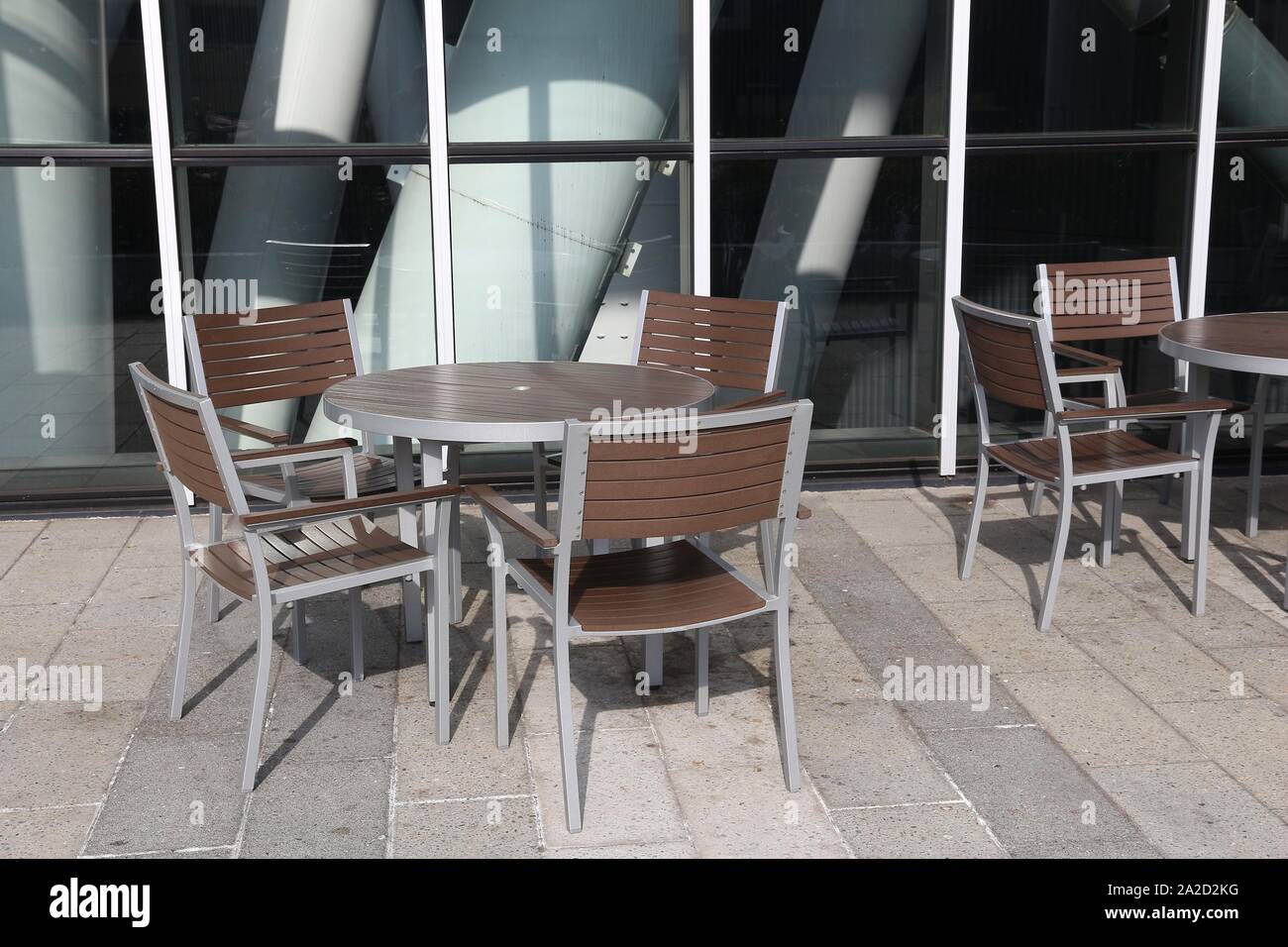 Generic modern outdoor cafe in Tokyo, Japan. Simple chairs and tables ...