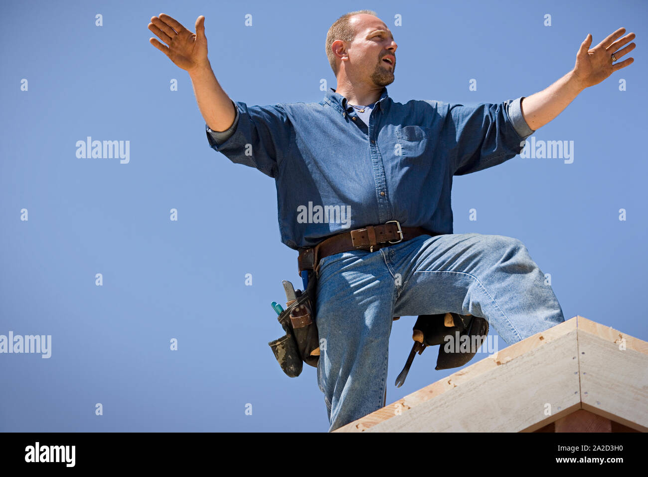 Man standing on roof beam hi-res stock photography and images - Alamy