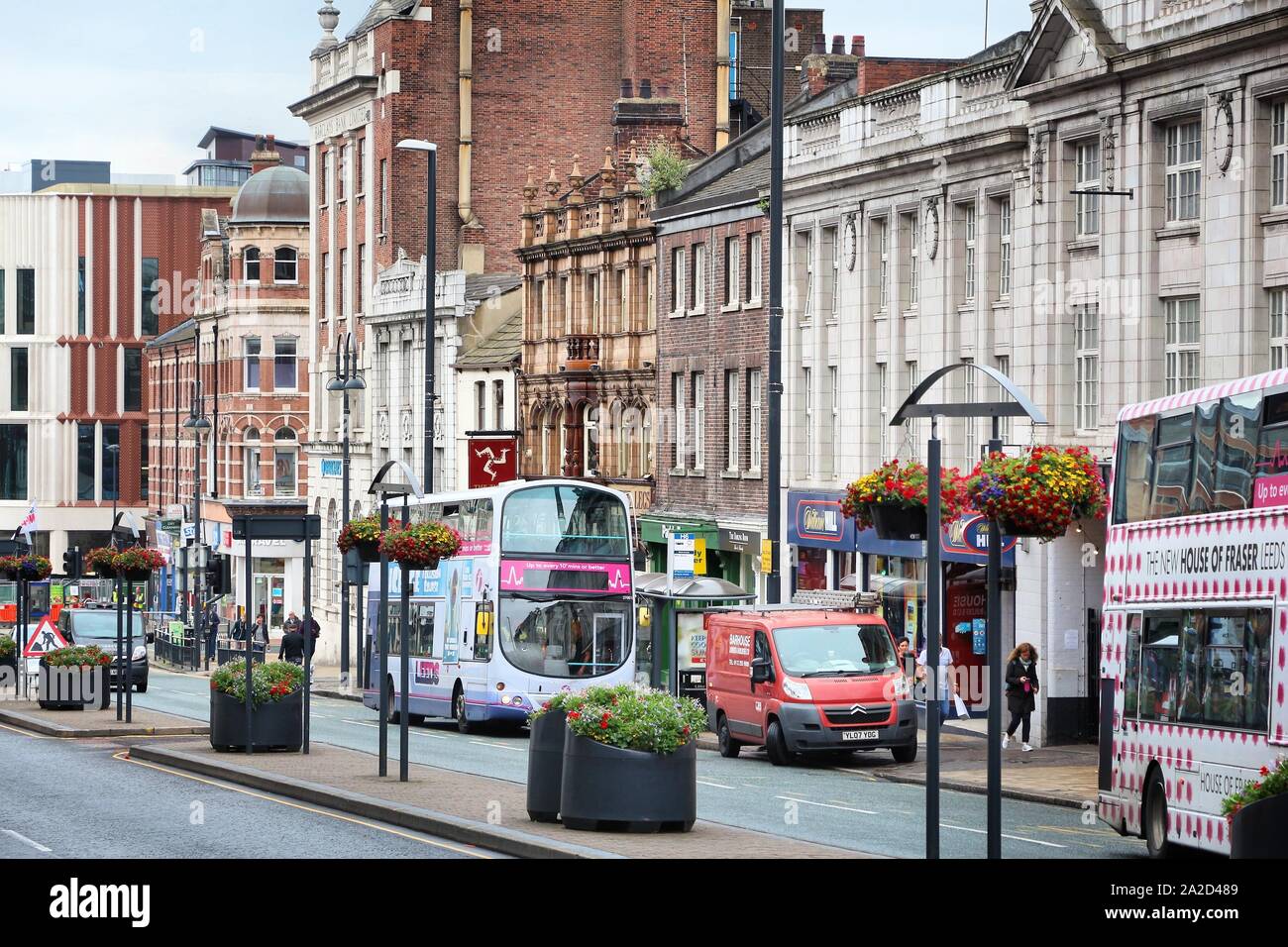 LEEDS, UK - JULY 11, 2016: People shop at Headrow street in downtown ...